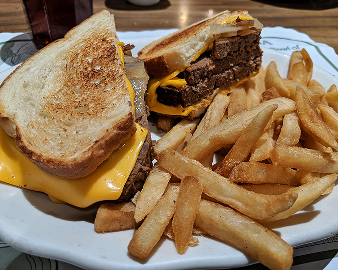 The patty melt&mdash;that glorious marriage of beef, melted cheese, and grilled bread&mdash;served with fries so perfectly golden they deserve their own Instagram account.