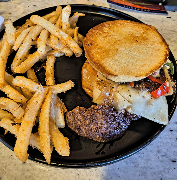 The patty melt: where beef meets melted cheese in a gravitational pull so strong that resistance is futile. Those fries? Crispy cosmic debris.