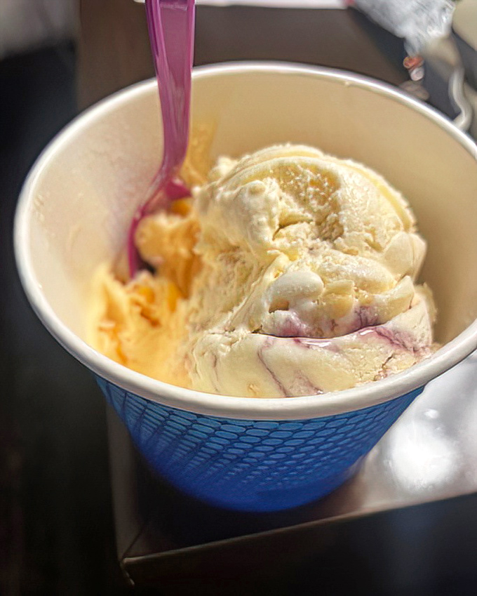 Swirls of creamy goodness that capture summer in every spoonful. That purple ribbon isn't just color&mdash;it's flavor performing a ballet on your taste buds.