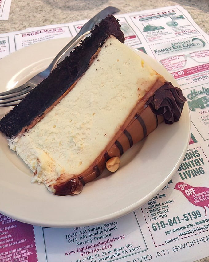 Layer upon layer of decadence—chocolate and cheesecake unite in a slice that's worth every calorie and might require a moment of silent appreciation.
