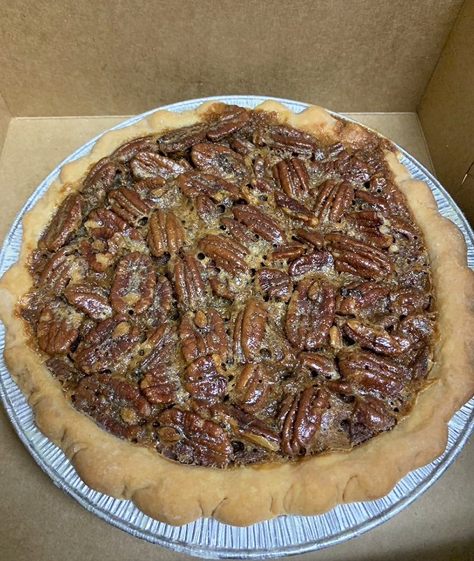 Pecan pie so densely populated with nuts, it looks like they're having a convention under that glistening, sweet canopy.