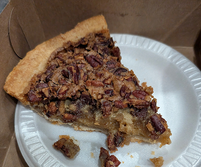 Pecan pie so rich it should have its own tax bracket, with a perfect filling-to-nut ratio that would make mathematicians weep with joy.