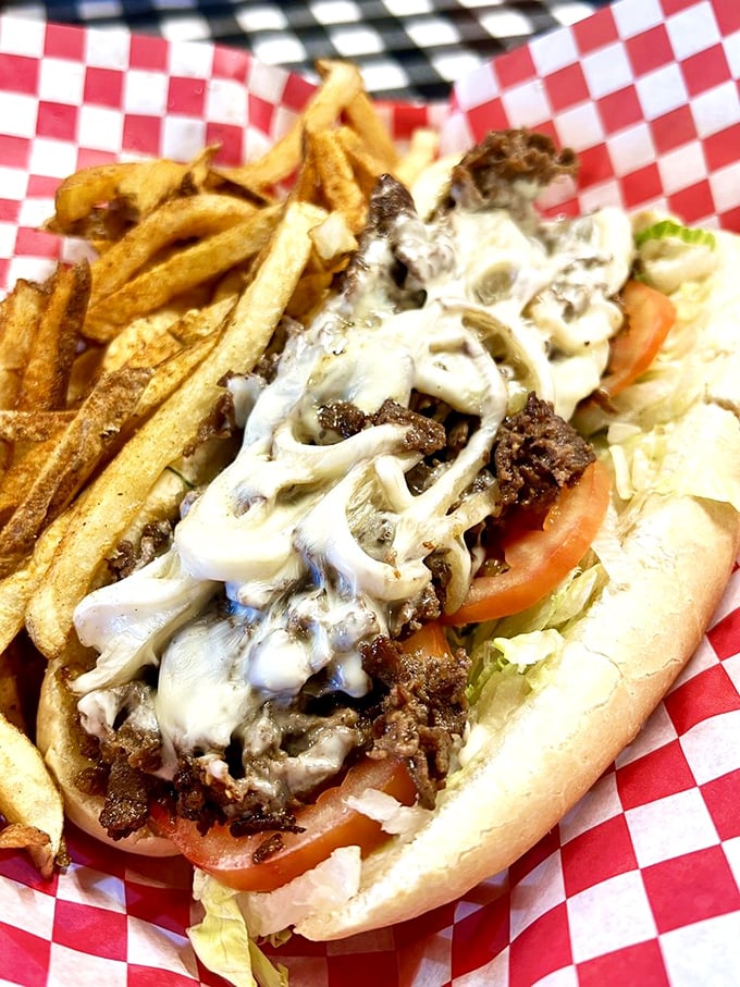 This Philly cheesesteak with hand-cut fries isn't just lunch&mdash;it's therapy. The melted cheese blanket is doing emotional support work that would cost $200 an hour elsewhere.