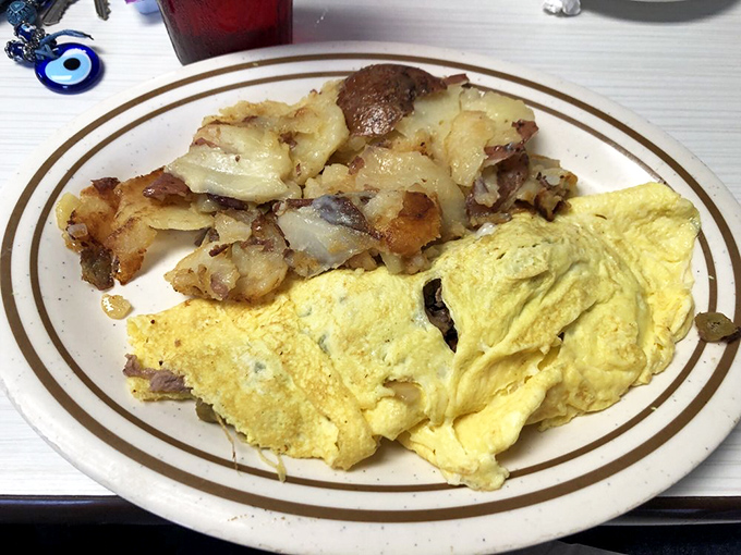 A proper diner omelet should be fluffy yet substantial, filled generously and paired with potatoes that could stand alone. Mission accomplished.
