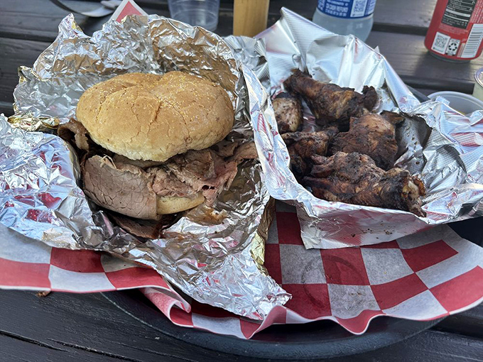 The perfect barbecue duo: a pit beef sandwich so good it deserves its own zip code, alongside wings that flew too close to smoky perfection.