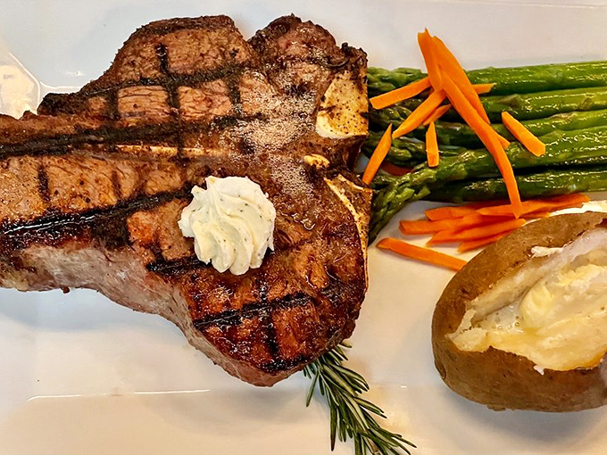 The porterhouse arrives like a meaty monument, perfectly charred outside, pink inside, with vegetables playing a respectful supporting role.