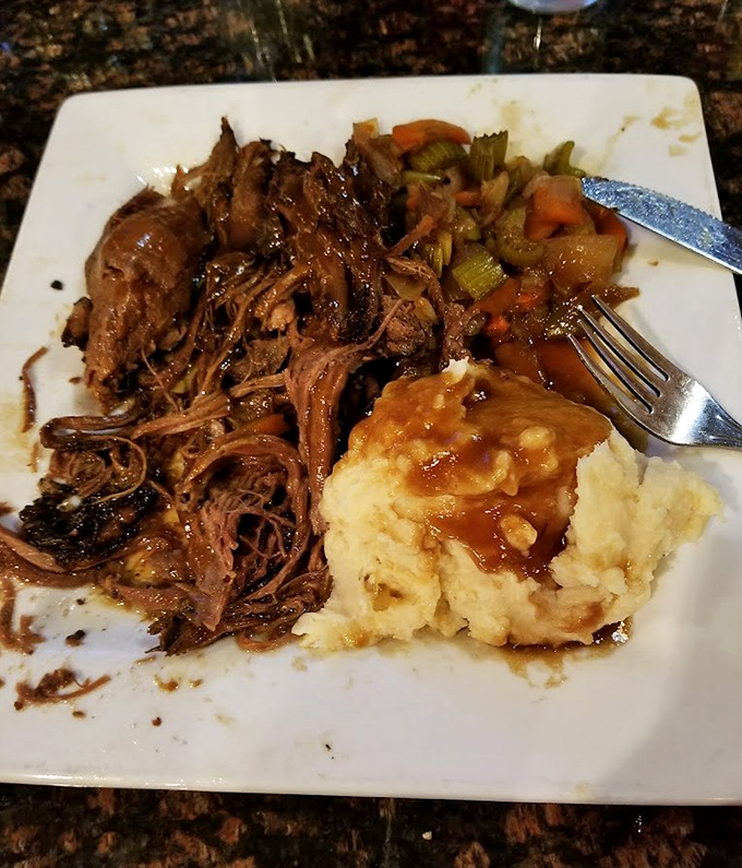 Pot roast that transports you straight to Grandma's Sunday dinner table, if Grandma had gone to culinary school and earned a Michelin star.