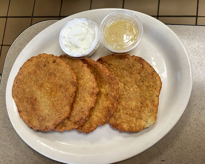 Golden-brown potato pancakes with the perfect crisp-to-tender ratio, waiting for their applesauce and sour cream companions.