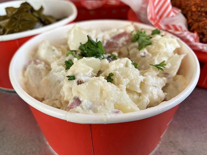 Not your bland picnic potato salad. This creamy, herb-flecked side dish provides crucial cooling relief between bites of fiery chicken.