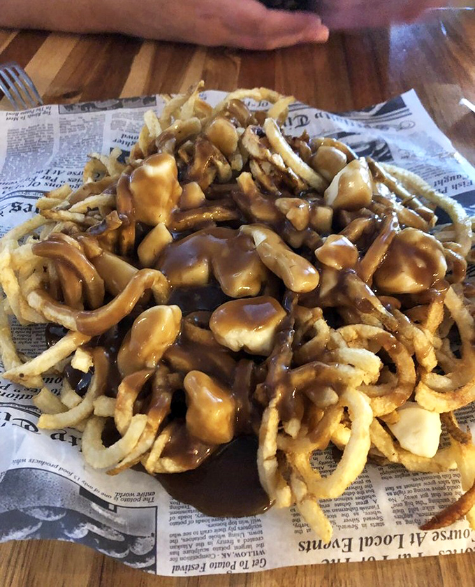 Poutine that would make Canadians consider annexing Conneaut&mdash;crispy fries drowning happily in gravy and cheese curds like they've found their true purpose in life.