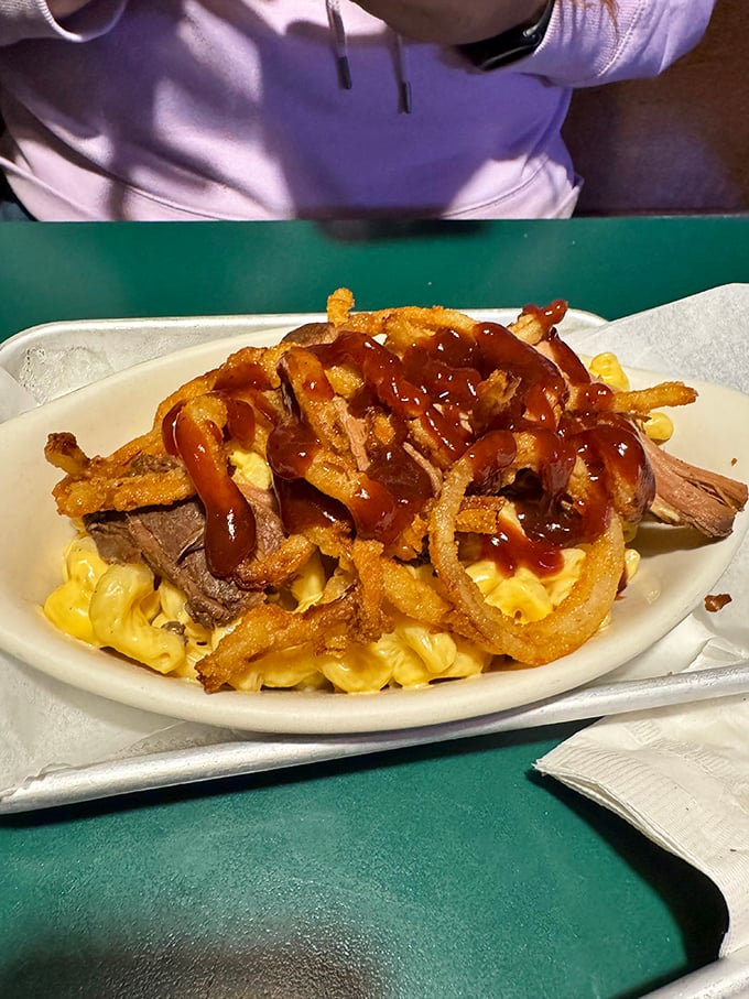 Mac and cheese topped with tender beef and crispy onion strings&mdash;proof that sometimes the best comfort foods are the ones that join forces.