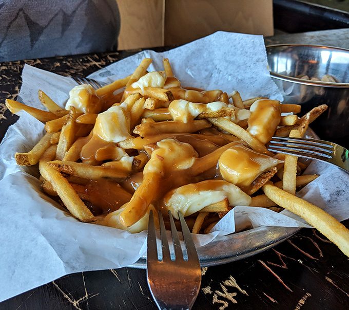 Poutine gets the Wisconsin treatment at AJ Bombers&mdash;crispy fries drowning under a blanket of cheese sauce that would make a Canadian simultaneously weep and applaud.