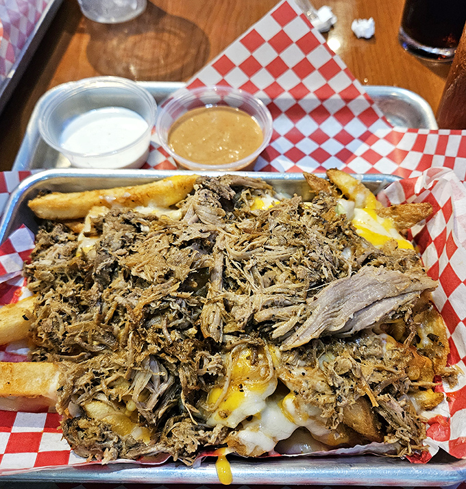 Fry heaven achieved! These loaded fries smothered in pulled pork and cheese are what diet cheat days were invented for.