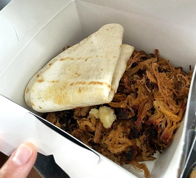 Pulled pork perfection nestled beside a warm tortilla&mdash;a beautiful relationship that proves some of the best partnerships are the simplest ones.