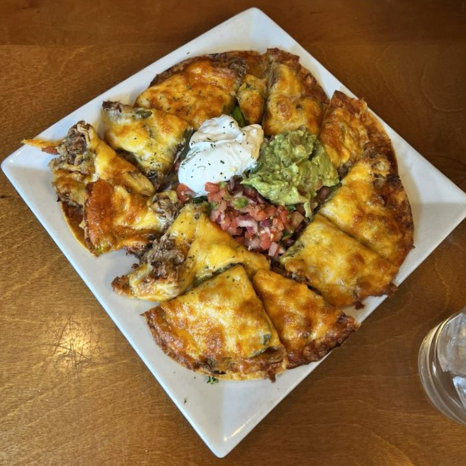 Architectural genius meets flavor explosion. These pulled pork nachos solve the age-old problem of naked chips at the bottom of the pile.