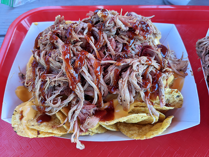 Nachos reimagined as a delivery system for pulled pork. Whoever thought of this deserves a Nobel Prize in Snackology.