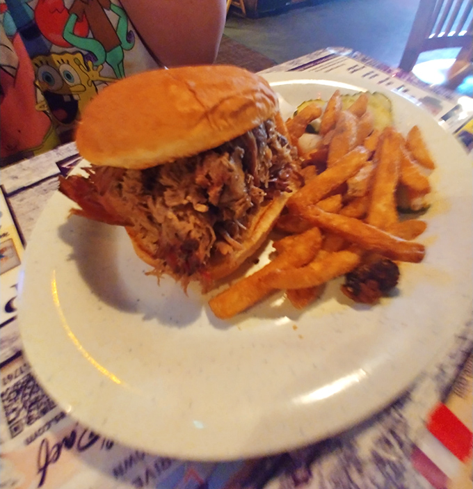 This pulled pork sandwich isn't just a meal, it's architectural achievement&mdash;towering with tender meat that's been introduced to smoke and time.