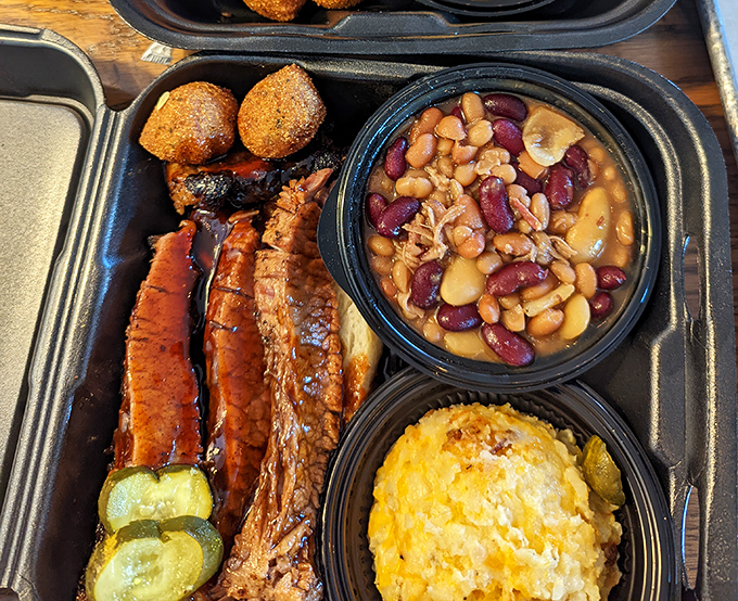 Baked beans mingling with perfectly smoked meats and corn casserole &ndash; proof that side dishes deserve just as much respect as the main event.