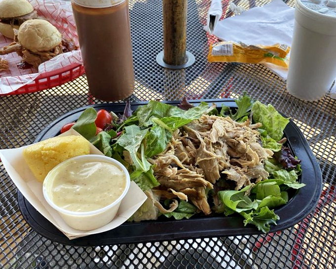Pulled pork atop fresh greens: the culinary equivalent of wearing a tuxedo t-shirt&mdash;formal enough to feel sophisticated, casual enough to truly enjoy.
