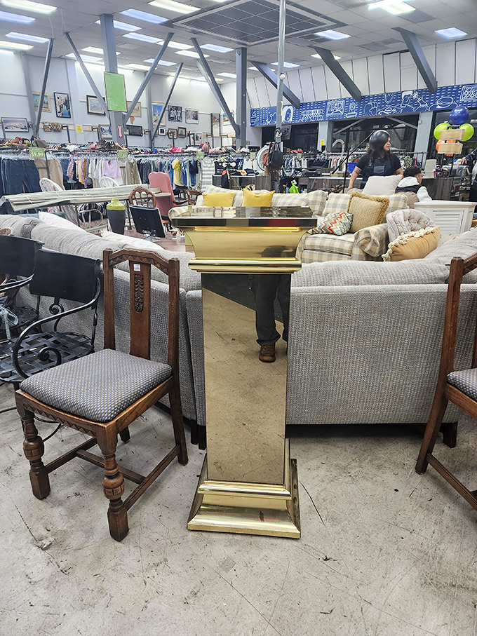 A living room tableau that could be straight from a design magazine, proving secondhand furniture can look first-rate with the right eye.