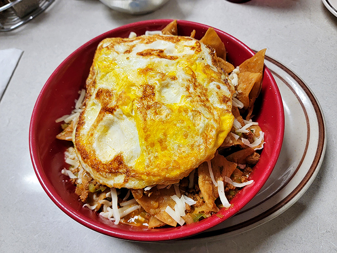 Ray's Combination Skillet laughs at your diet plans. Those sunny-side-up eggs aren't just toppings—they're golden crowns for a breakfast worthy of royalty.