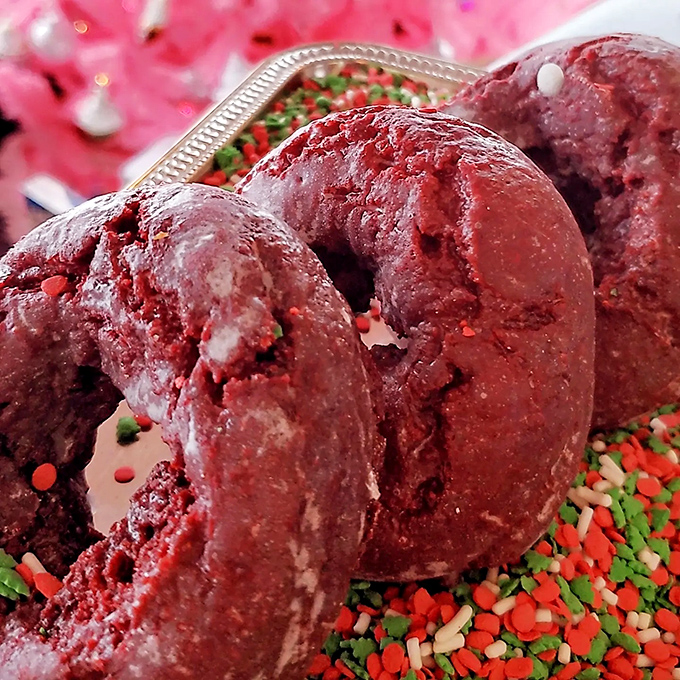 Red velvet donuts with a chocolate drizzle that would make even the most disciplined dieter whisper, "Worth it."