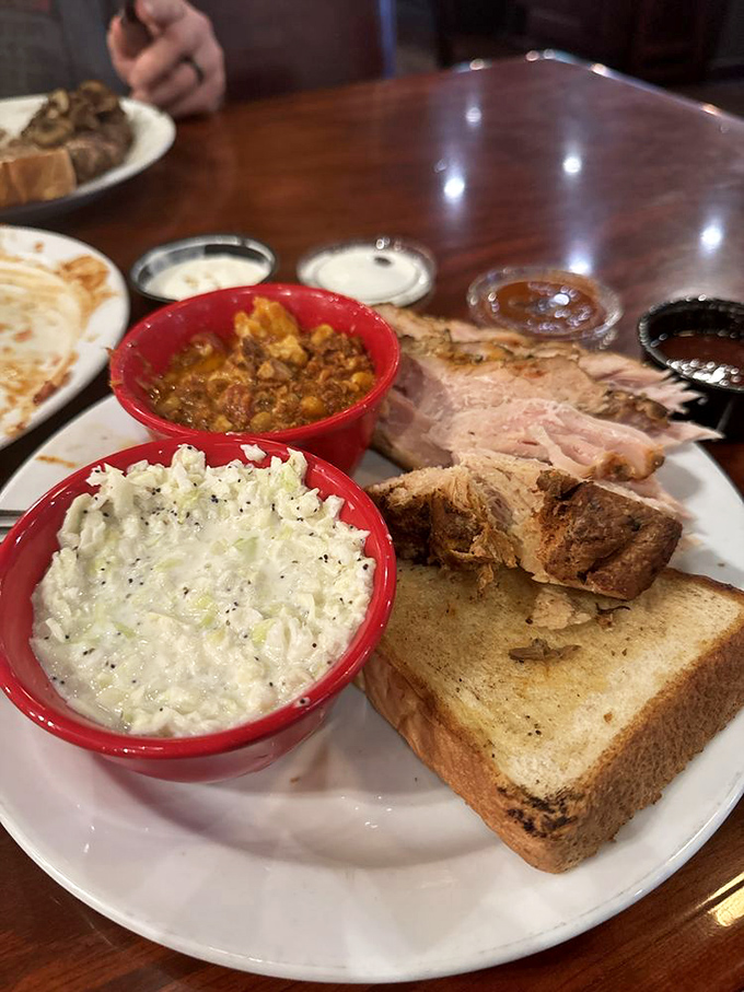 Red bowls of delight&mdash;where coleslaw provides creamy counterpoint to what appears to be Brunswick stew, with Texas toast standing by for cleanup duty.