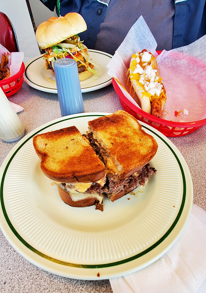 The meltiest, messiest, most magnificent burger creation that requires both hands, several napkins, and absolutely zero regrets afterward.