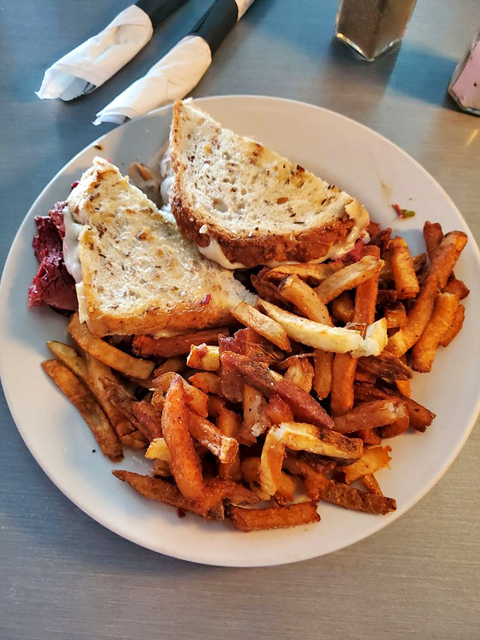 Sandwiches should be architecturally sound and aesthetically pleasing. This one, with its golden-brown edges and mountain of fries, checks both boxes masterfully.