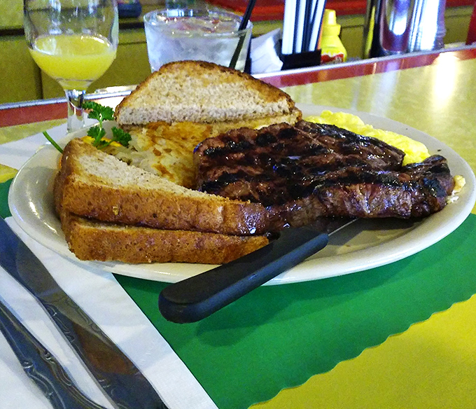 Breakfast of champions: a perfectly grilled steak alongside golden eggs and toast&mdash;the kind of hearty plate that fuels Wisconsin's hardworking spirit.