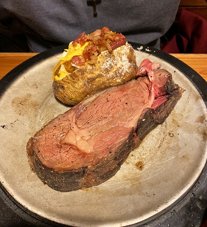 Medium-rare ribeye and a loaded baked potato&mdash;the kind of plate that makes you want to cancel your evening plans and linger.
