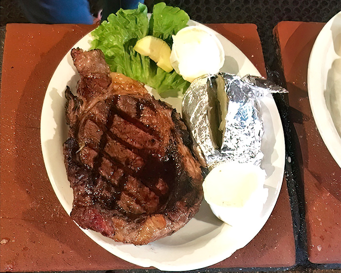 This ribeye has the kind of char that makes vegetarians question their life choices. The perfect marriage of crust and tenderness that defines steakhouse excellence.