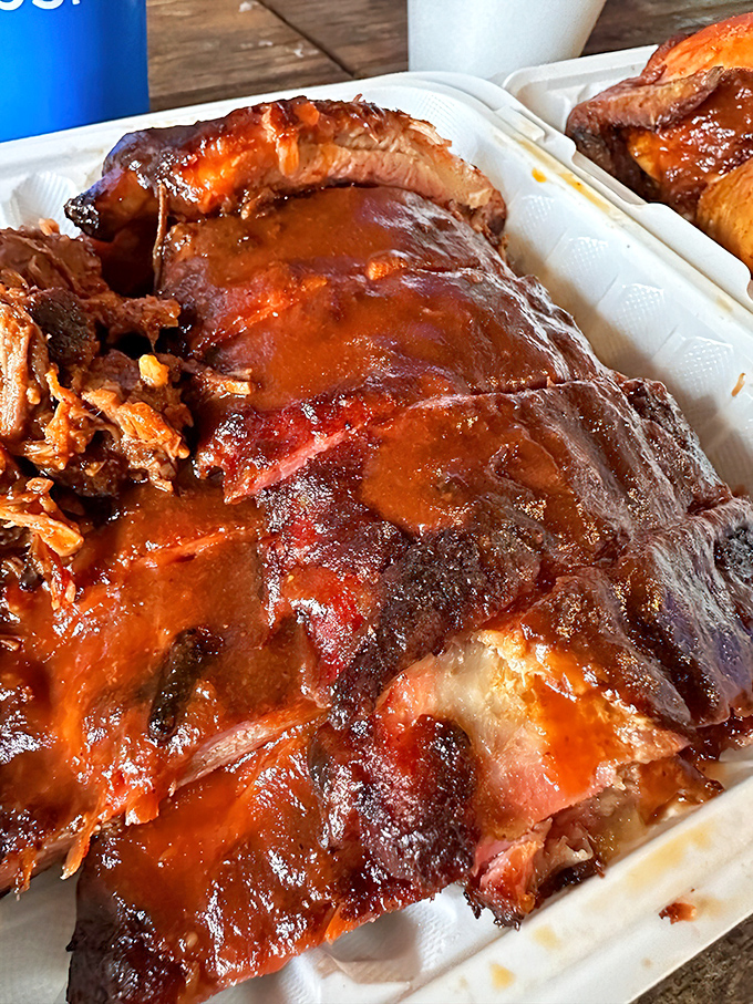 These ribs don't just fall off the bone&mdash;they practically leap into your mouth, glistening with that perfect lacquer of sauce and smoke.