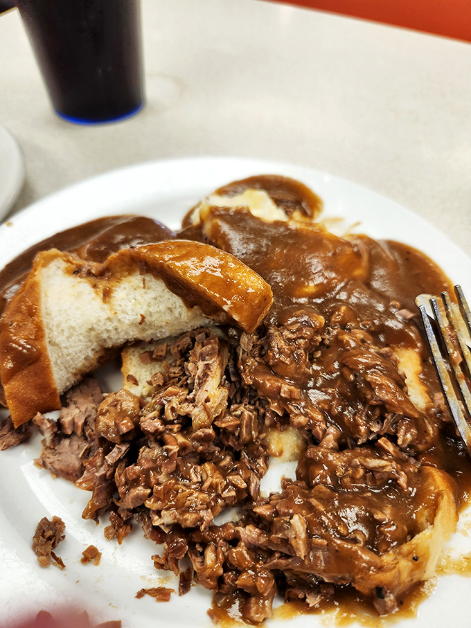 Roast beef that surrenders at the touch of a fork, swimming in gravy that's clearly been simmering since dawn. This isn't lunch&mdash;it's edible therapy.