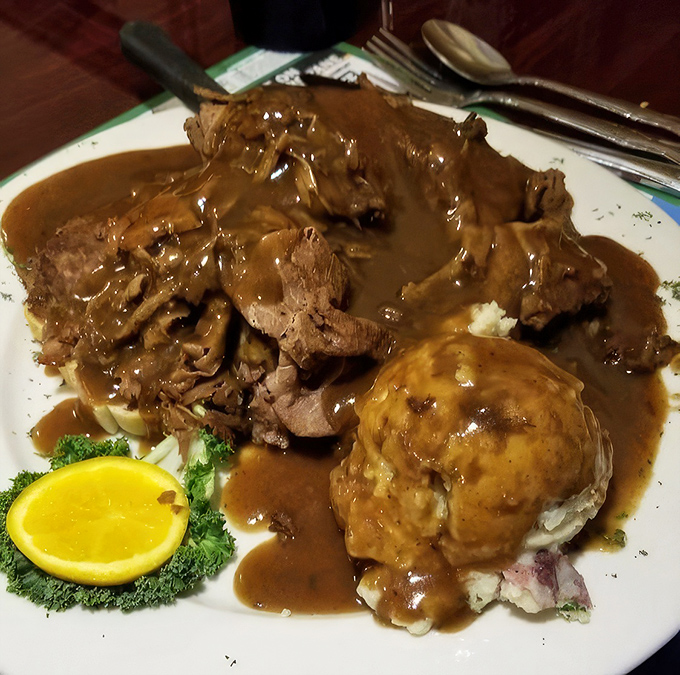 Pot roast so tender it practically surrenders at the sight of your fork, swimming in gravy that deserves its own fan club. 
