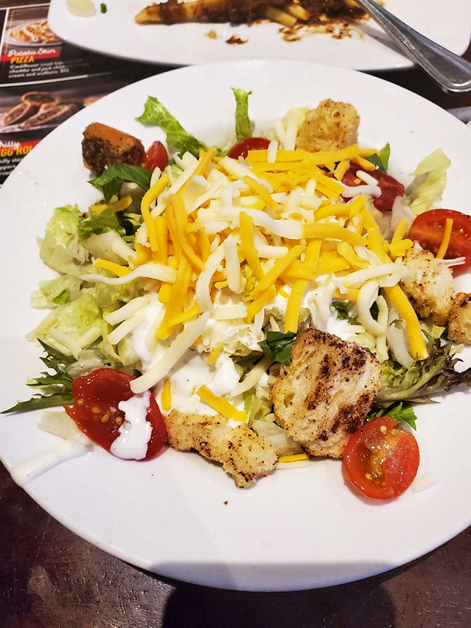 A salad that doesn't apologize for being healthy. Fresh ingredients playing together like a well-coordinated team, with cheese as the MVP.