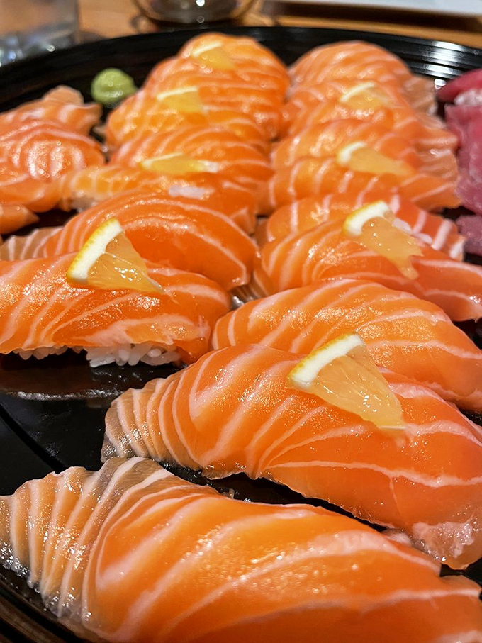 Salmon so vibrant it practically glows. These jewel-toned slices are what sushi dreams are made of&mdash;ocean freshness in every bite.