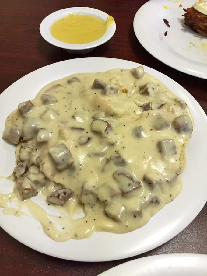 Biscuits swimming in creamy sausage gravy&mdash;the kind of dish that makes you want to hug the chef and schedule a cholesterol test.
