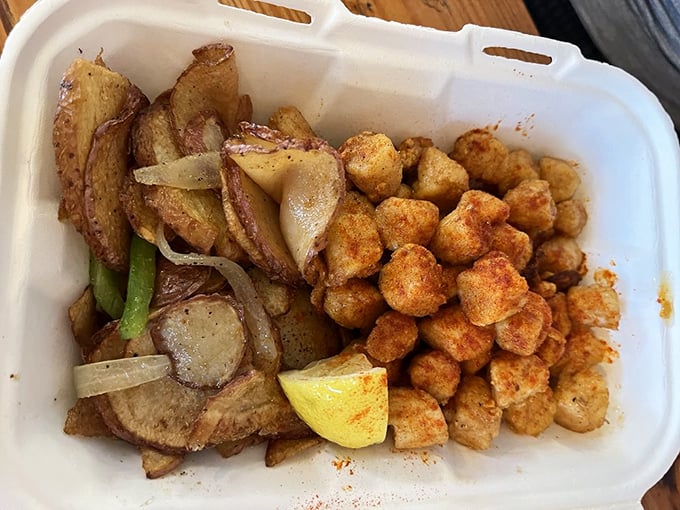 Potatoes and scallops sharing a container like odd roommates who surprisingly get along beautifully.