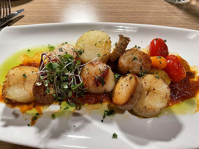 Scallops seared to golden perfection, surrounded by a colorful medley of tomatoes and microgreens. Ocean candy for grown-ups!