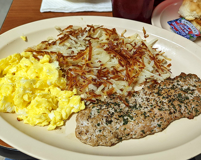 Perfectly scrambled eggs that look like golden clouds, proving that simple done right beats fancy done wrong.