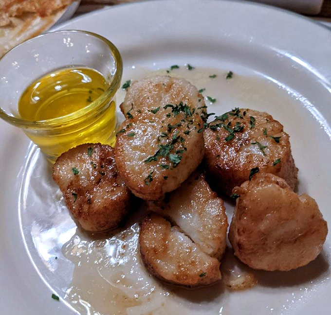 These sea scallops are caramelized to golden perfection&mdash;like little butter-kissed treasures from Neptune himself. The drawn butter is just showing off.