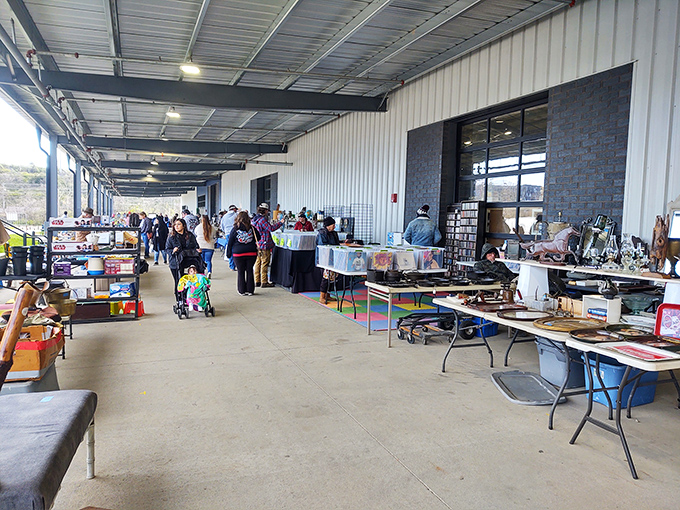 The indoor market hums with activity as shoppers scan tables for treasures. Like archaeologists of pop culture, they sift through decades of American life.