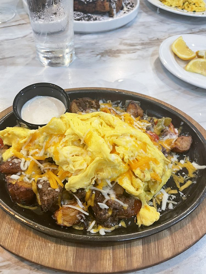 Breakfast gets serious with this short rib skillet&mdash;where fluffy eggs and melted cheese meet savory beef in a morning romance that's worth setting the alarm for.