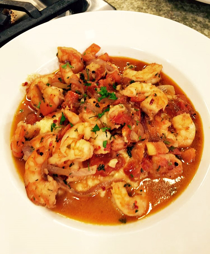 Shrimp swimming in a savory tomato bath that would make Neptune himself request seconds. Comfort food with coastal credentials.