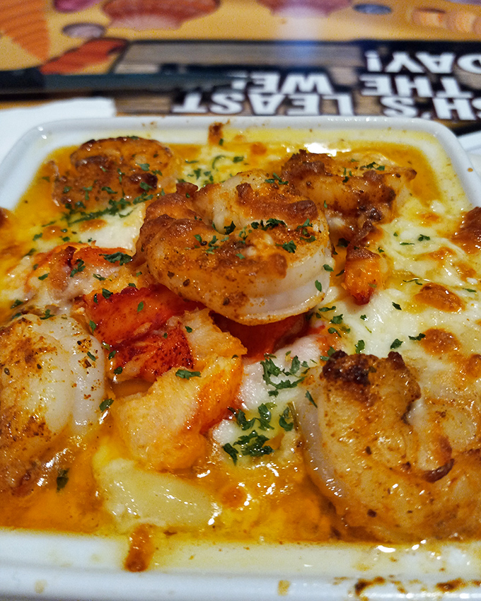 These shrimp aren't just sitting on the grits&mdash;they're having a flavor party and the cheese sauce got an exclusive invitation.