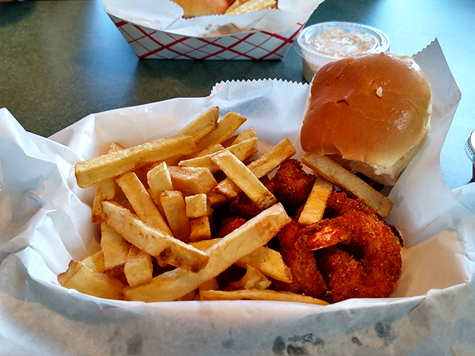 Shrimp and fries nestled in paper &ndash; no fancy plating needed when the food speaks this eloquently about simple pleasures.