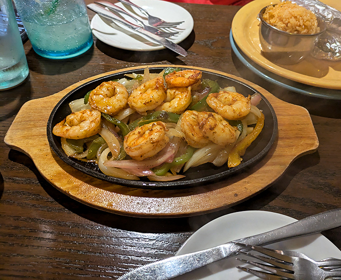 Sizzling shrimp fajitas that announce their arrival with a theatrical hiss and aroma that turns every head in the dining room.