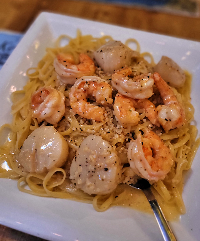 Shrimp and scallops over linguine that would make an Italian grandmother nod in approval while secretly taking notes.