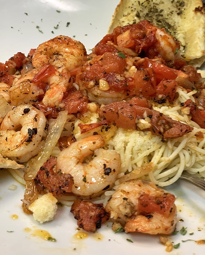 Shrimp that clearly took a delicious detour through Italy before landing on your plate. This scampi and its tomato-garlic companions create pasta perfection worth every carb.